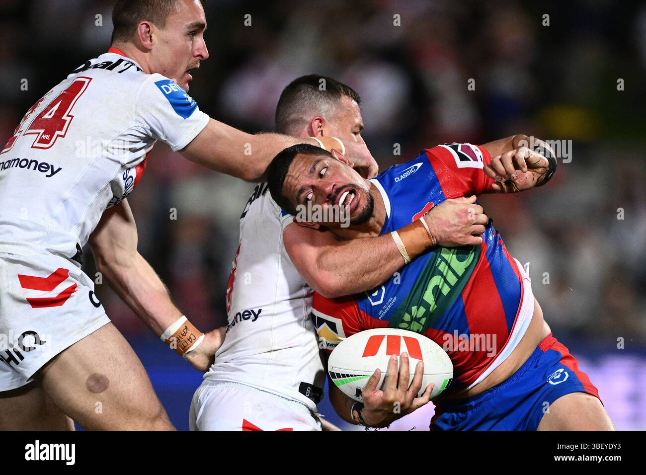 Sydney, Australia. 30th May, 2025. Dane Gagai of the Knights is tackled ...