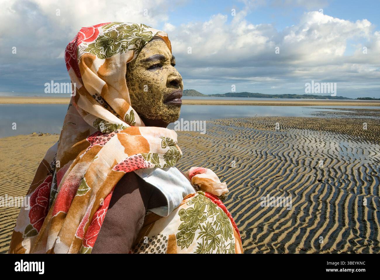 A Malagasy woman wearing protective mask called masonjoany, low tide on ...