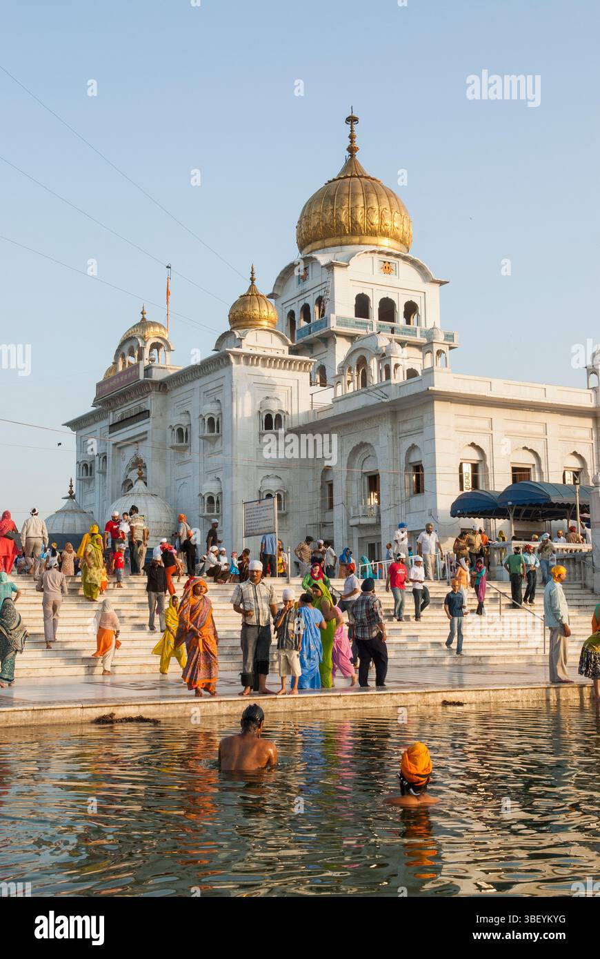 Followers bathing in the 'Sarovar' pond whose water is considered holy ...
