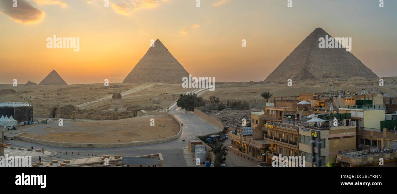 View of Giza Pyramids from rooftop terrace at sunset, Cairo, Egypt ...