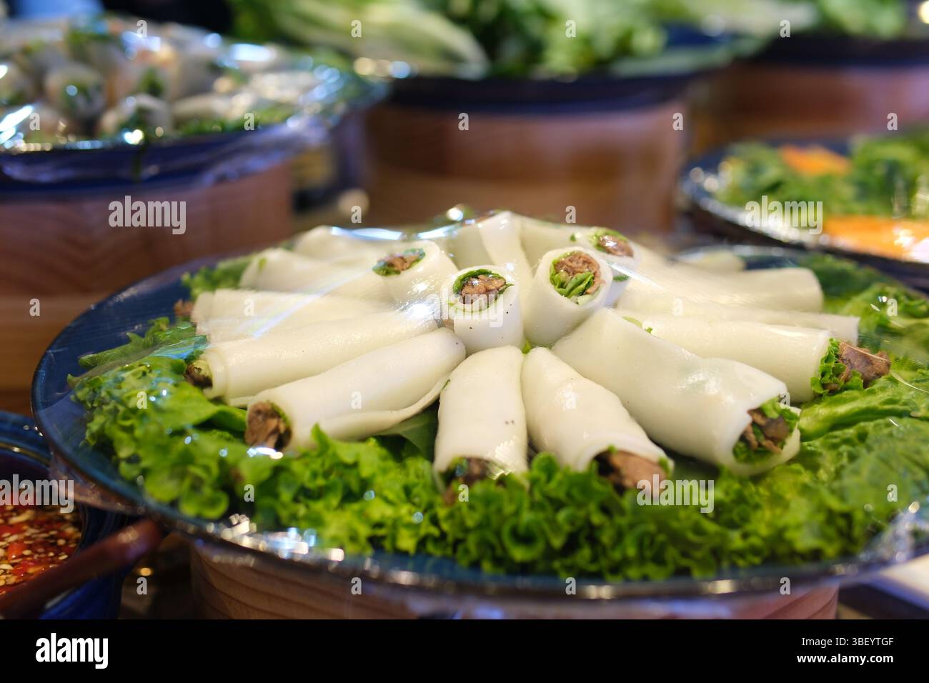 Vietnamese spring rolls with prawns in rice paper in blacl platter ...