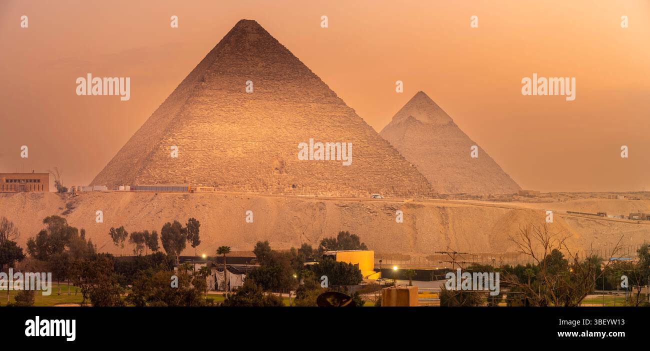 View of the Giza Pyramids from rooftop terrace during golden hour, Giza ...