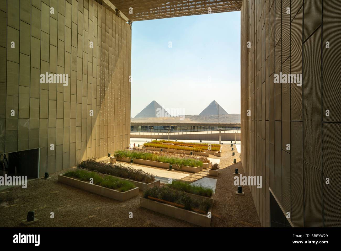 View of Giza Pyramids from the interior of the Grand Egyptian Museum ...
