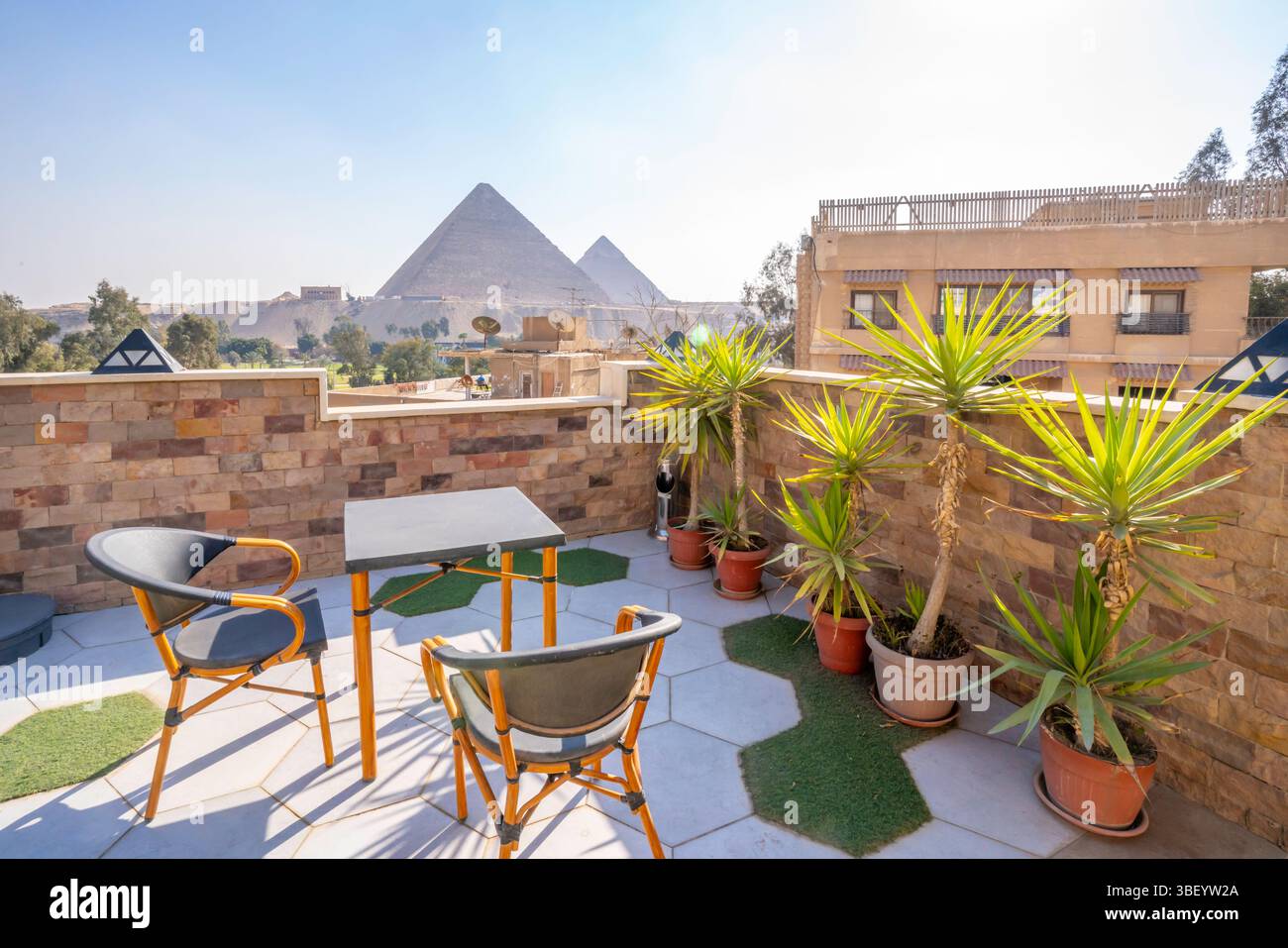 View of Giza Pyramids from rooftop terrace of hotel, Cairo, Egypt ...