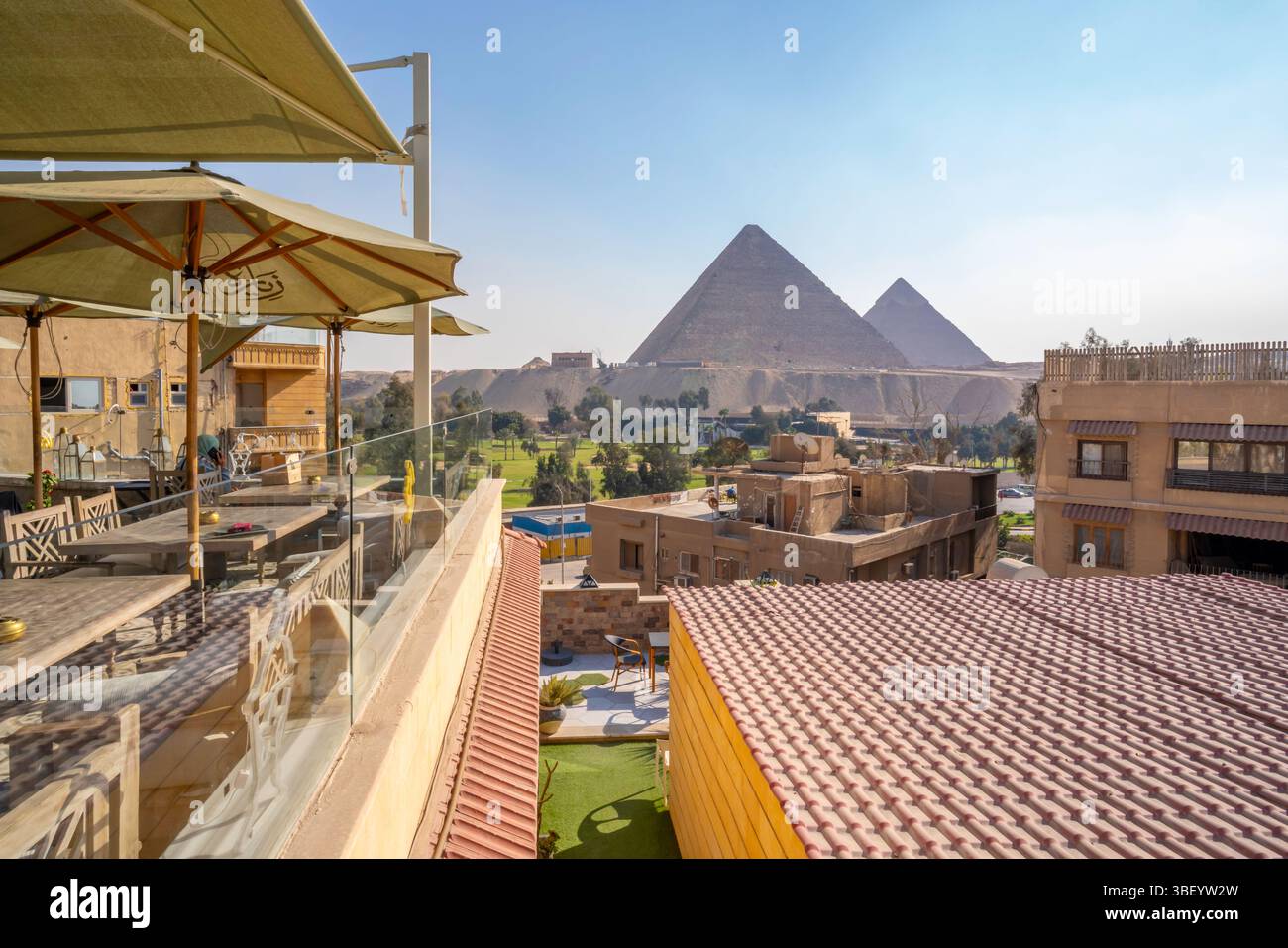 View of Giza Pyramids from rooftop terrace of hotel, Cairo, Egypt ...
