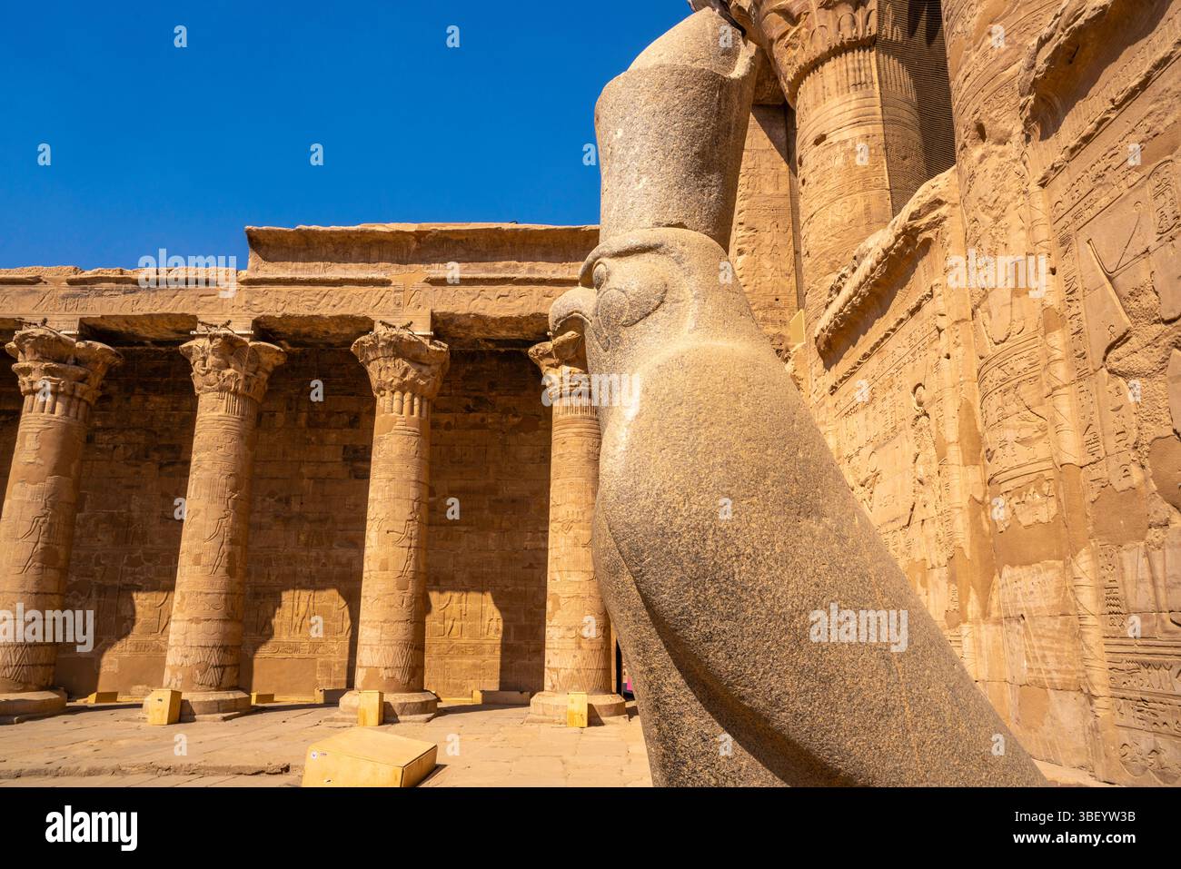 View of statue of Horus the falcon outside the doorway to the sandstone ...