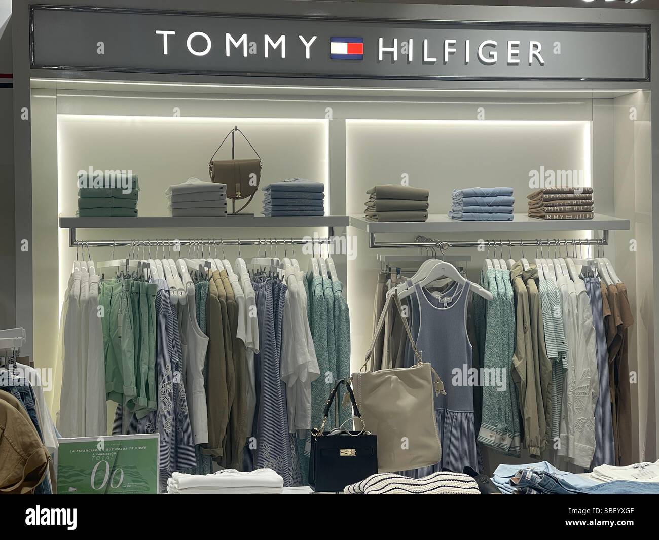 Tommy Hilfiger women's clothing display in Spanish store Stock Photo ...