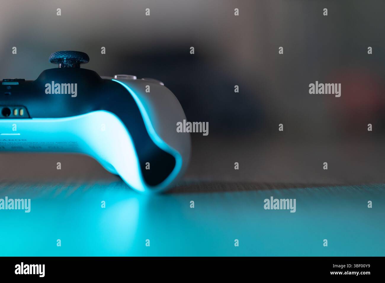 Brecht, Belgium - 18 april 2025: A blue neon portrait of half of a ...