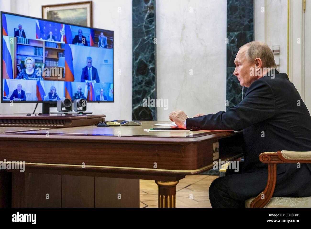 Russian President Vladimir Putin chairs a Security Council meeting via ...