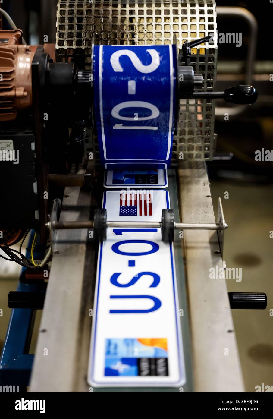 A license plate for the United States delegation is being printed ahead ...