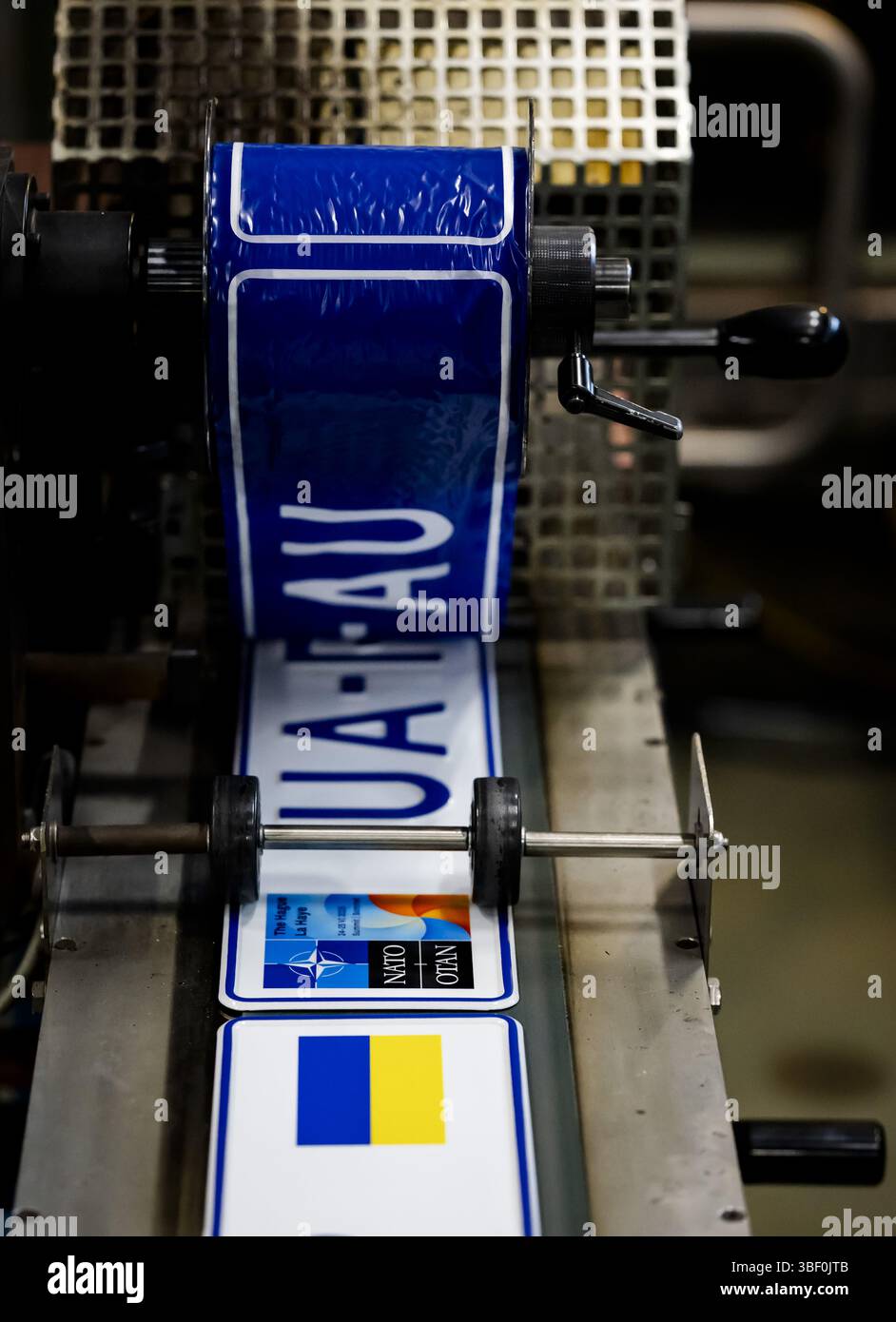 A license plate for Ukraine's delegation is being printed ahead of the ...