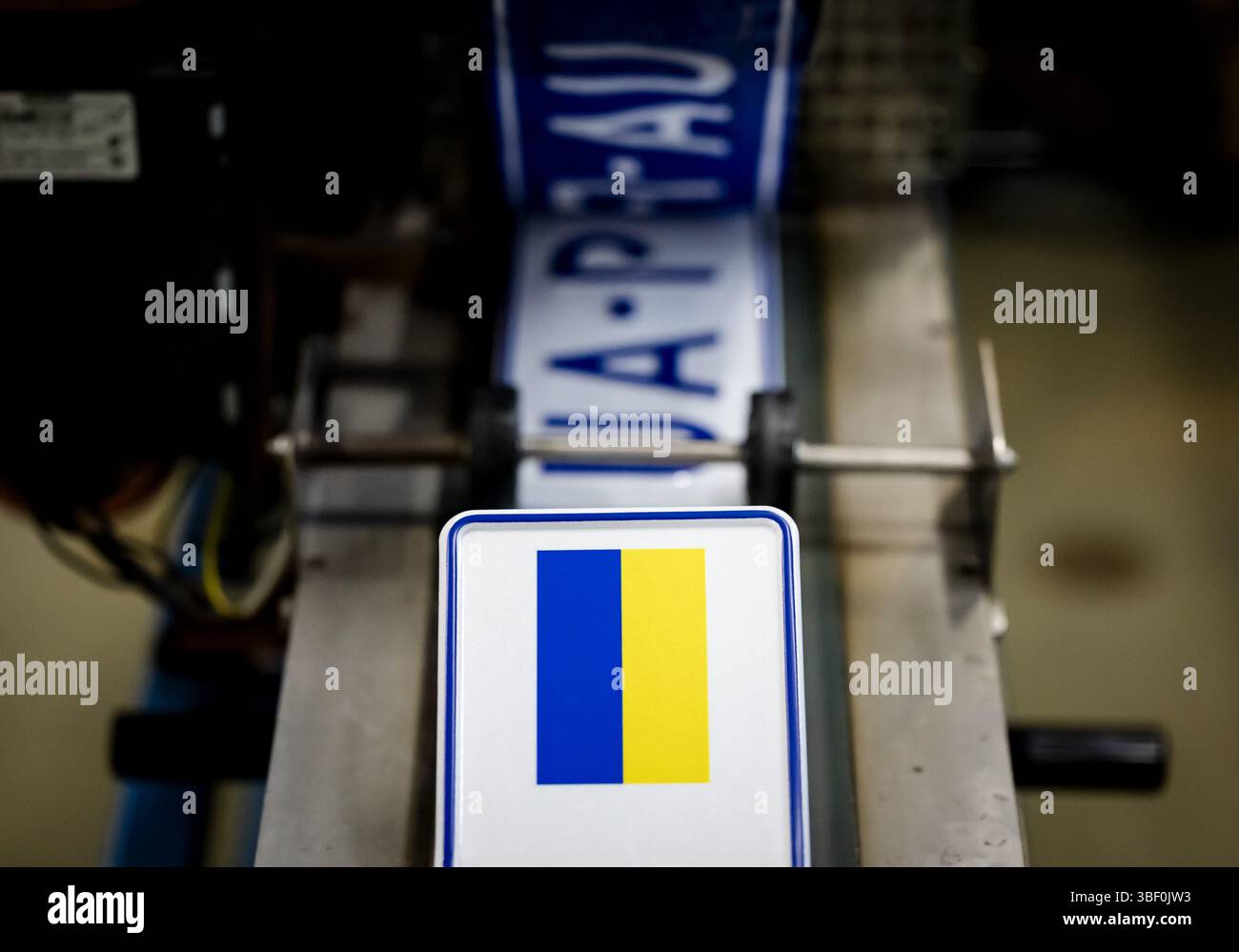 A license plate for Ukraine's delegation is being printed ahead of the ...