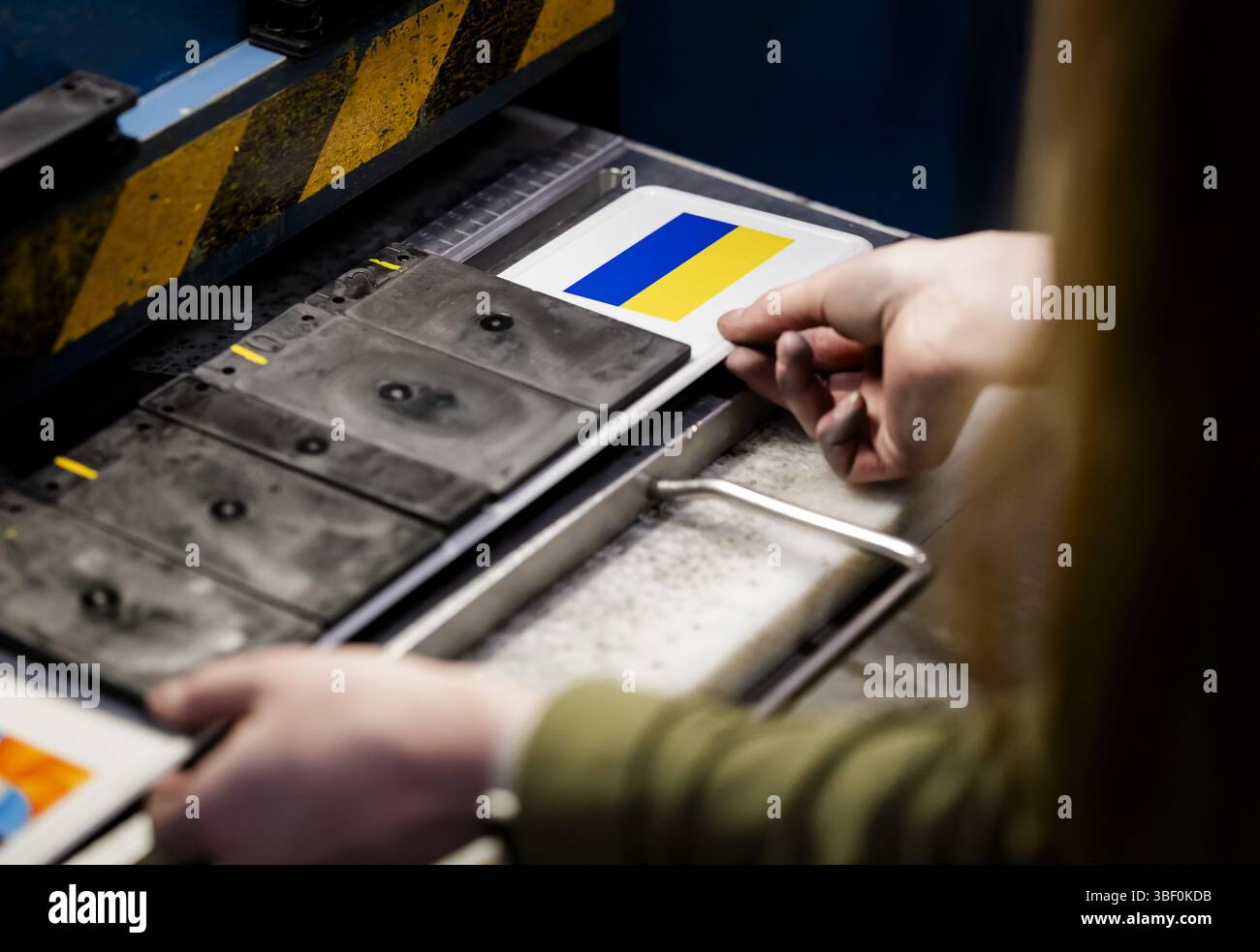 A license plate for Ukraine's delegation is being printed ahead of the ...