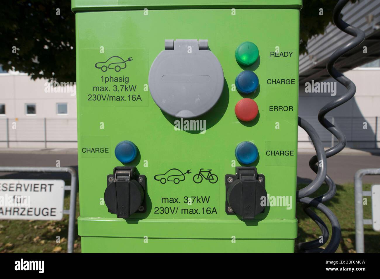 a green electricity filling station, charging vehicles with green power ...