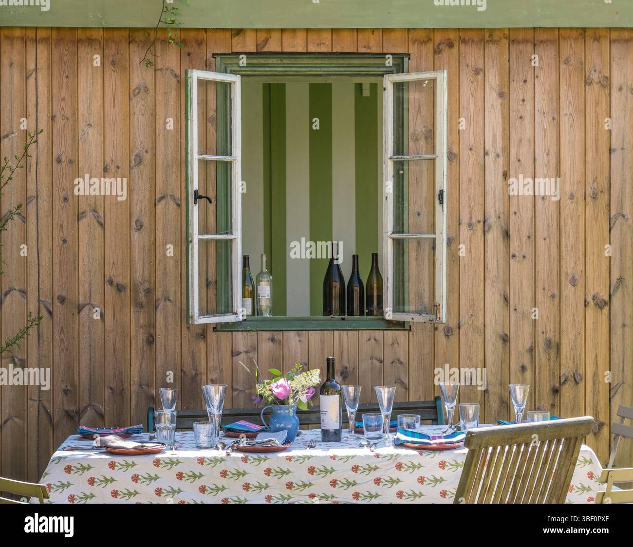 Summertime in Britain - a table laid for lunch in the garden, outside a ...