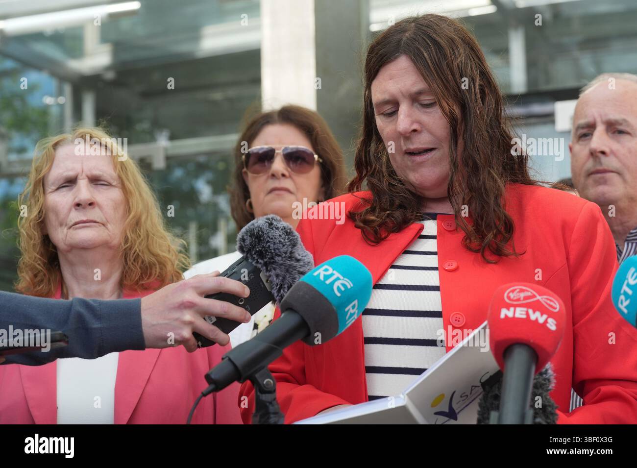 Lorraine Howard, the half-sister of Tina Satchwell, speaks to the media outside Central Criminal ...