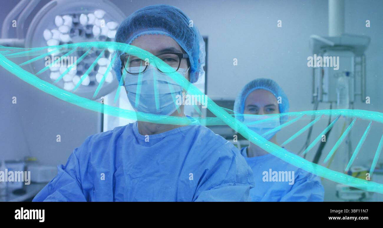 Image of dna strand over diverse surgeons with face masks Stock Photo ...