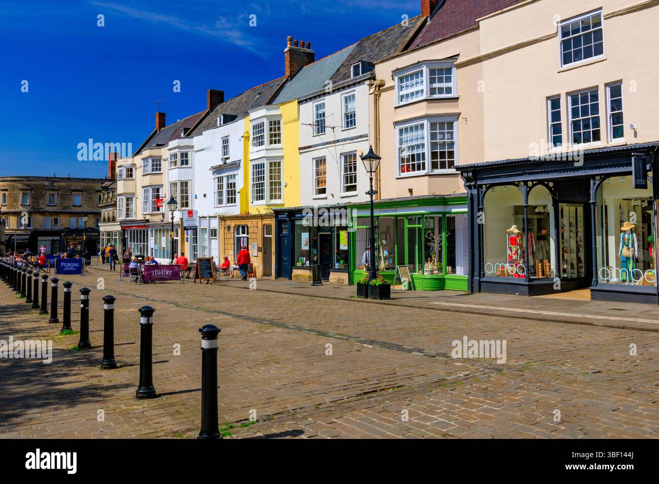 The colourful architecture in the cobbled historic Market Place in ...
