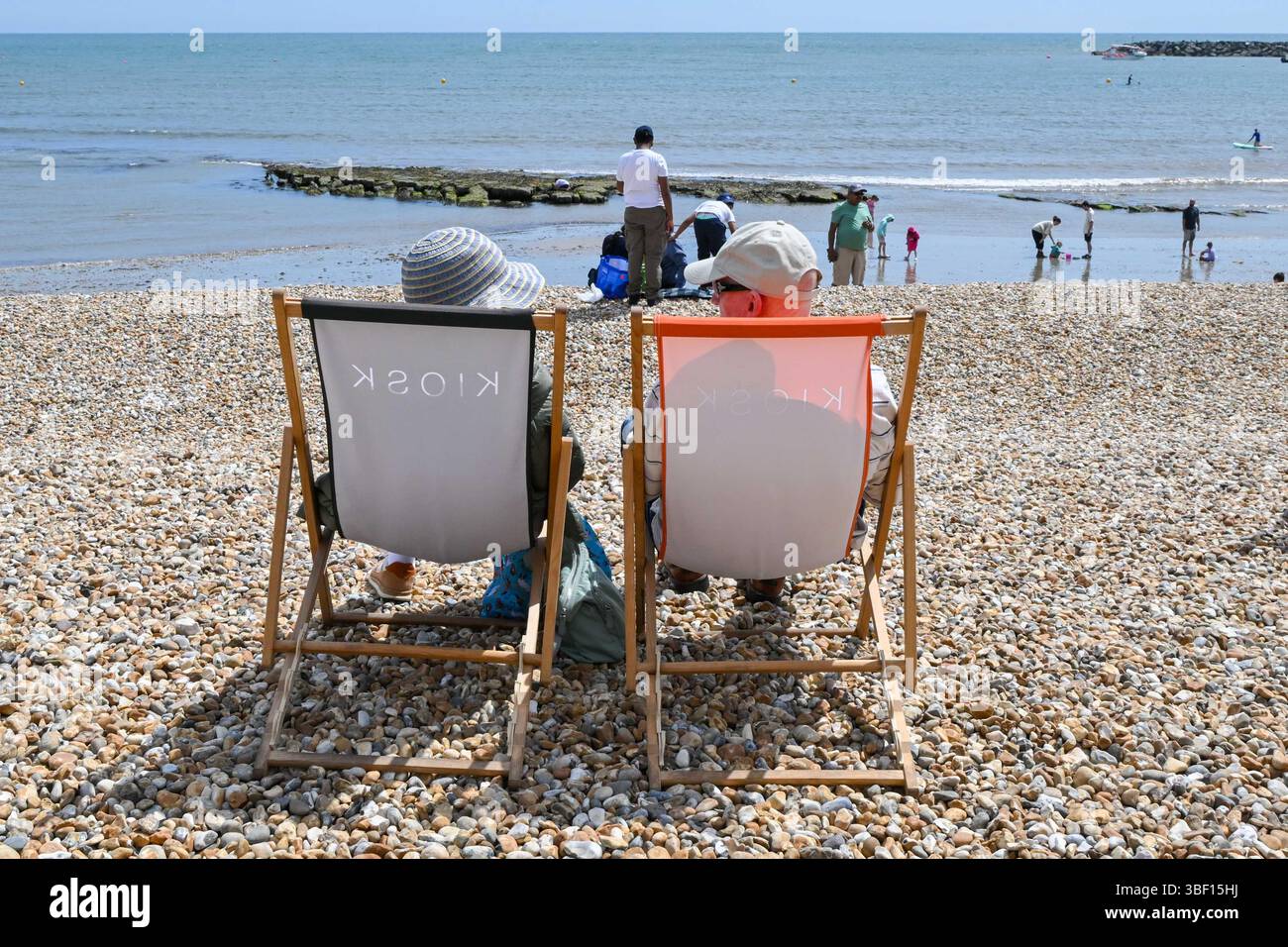 Lyme Regis, Dorset, UK. 30th May 2025. UK Weather. Sunbathers on the beach enjoying the ...