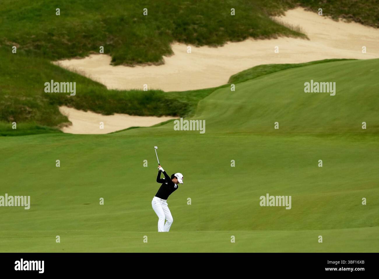 Youmin Hwang, of South Korea, hits from the fourth fairway during the second round of the U.S ...