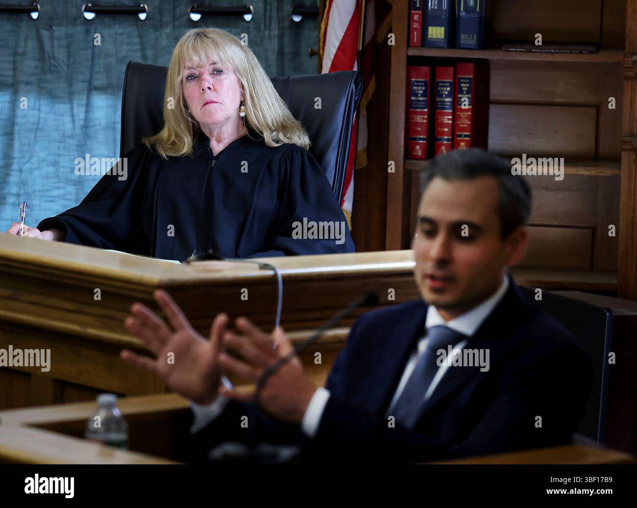 Judge Beverly Cannone, left, listens as accident reconstruction analyst ...