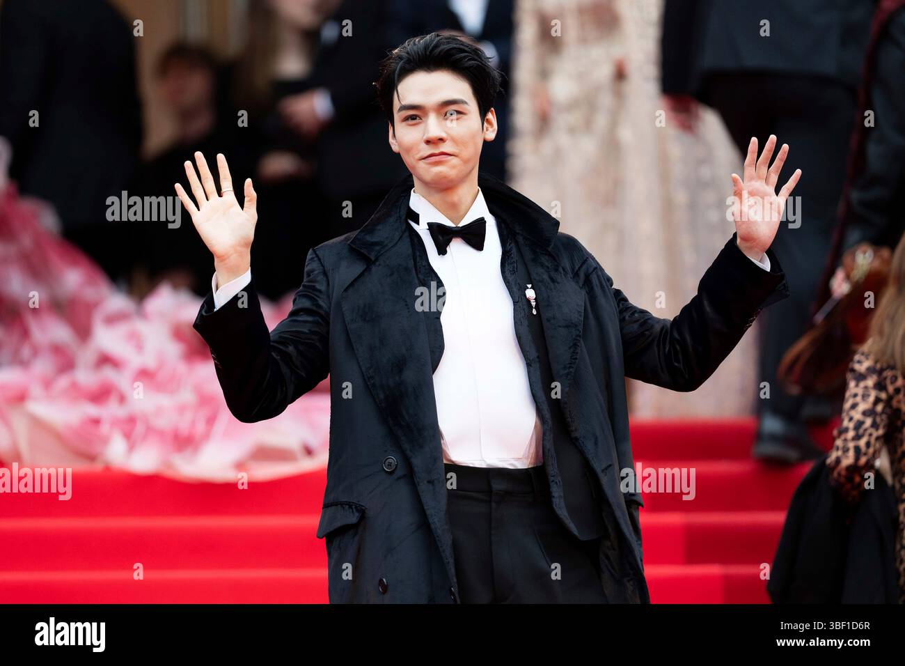 Gong Jun poses for photographers during the opening ceremony red carpet ...