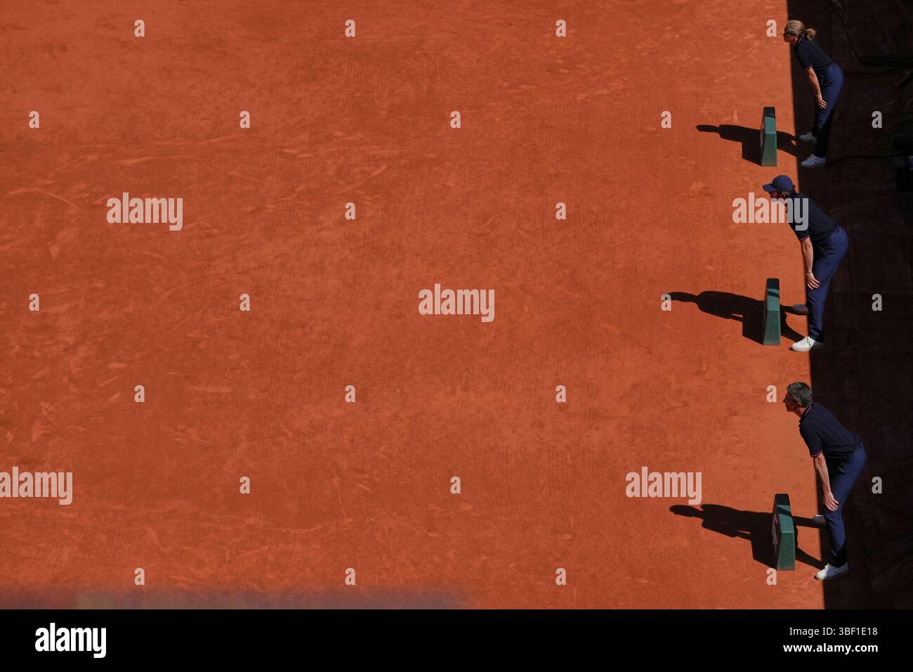 Line judges check the play during the third round match of the French ...