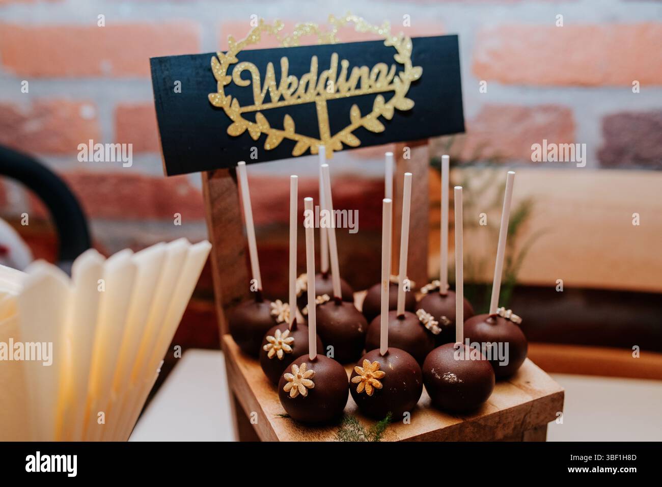A close-up photo of a table setting with a wooden stand holding a ...