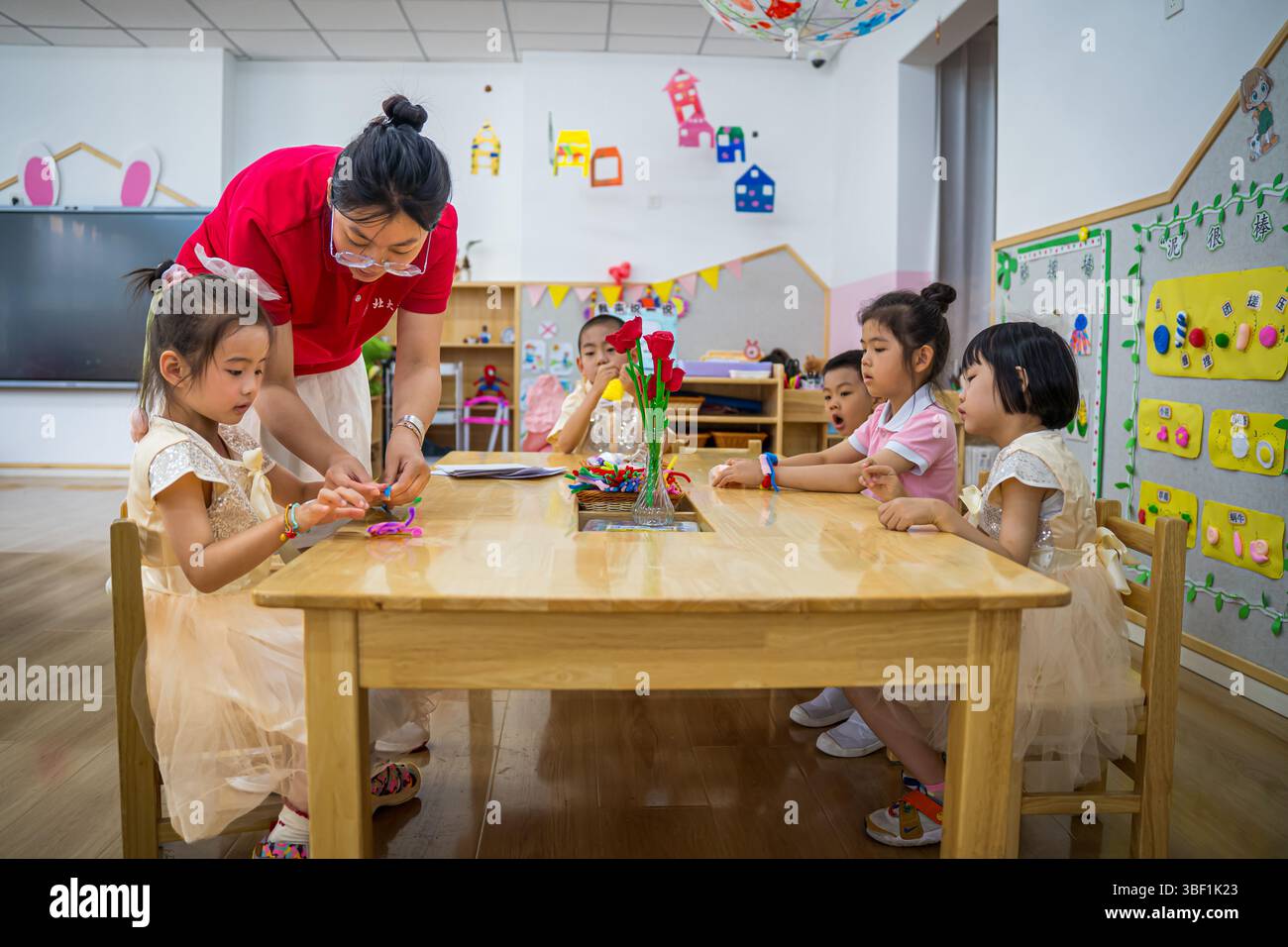 Beijing, China. 30th May, 2025. Children make handicrafts under a ...