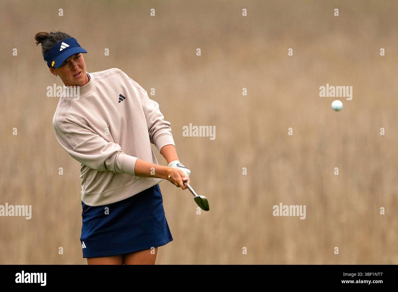 Linn Grant, of Sweden, hits on the first hole during the second round ...