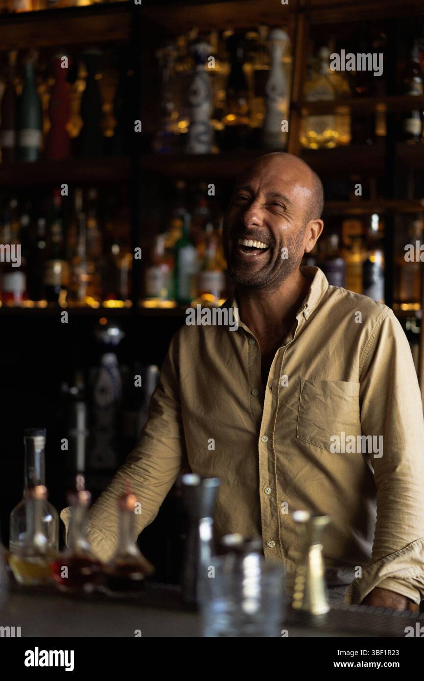 Mexican man talks about mezcal and tequila in a bar, master class Stock ...
