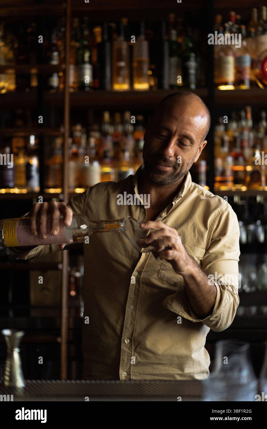 Mexican man talks about mezcal and tequila in a bar, master class Stock ...