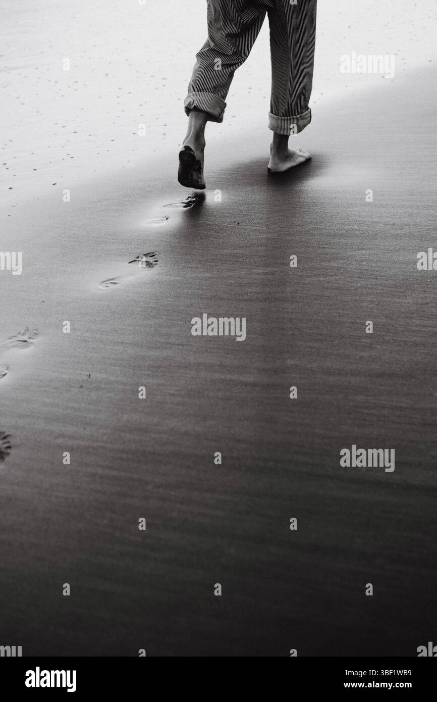 Man's footprints in the sand Stock Photo - Alamy