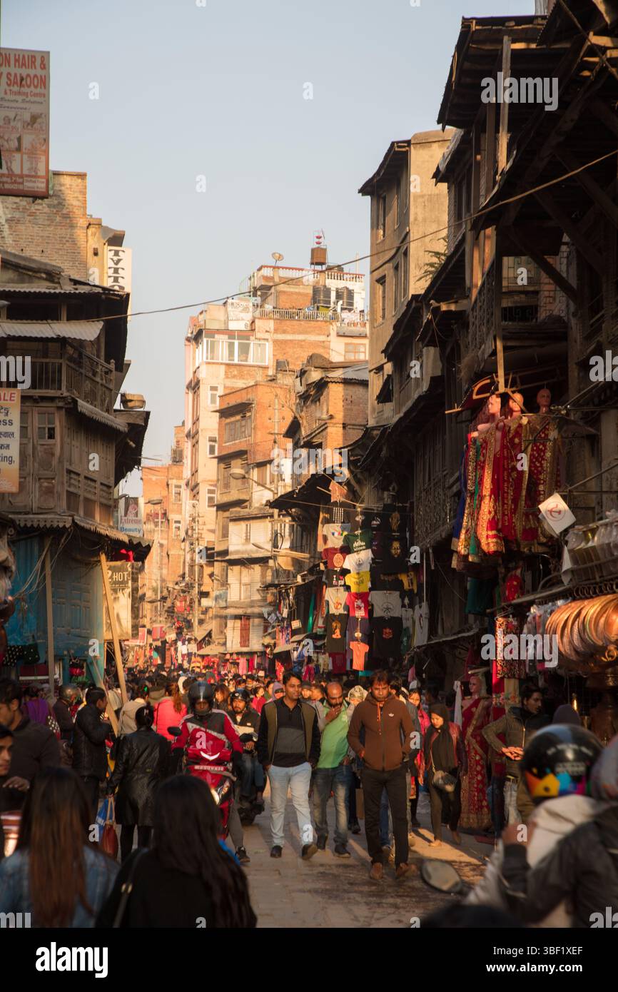 Shoppers and vendors crowd a busy street in Kathmandu, Nepal, buying ...