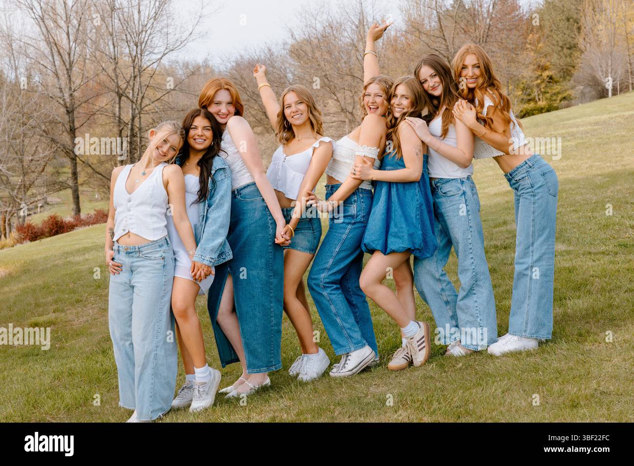 Generation z university students wearing denim and white outfits Stock ...