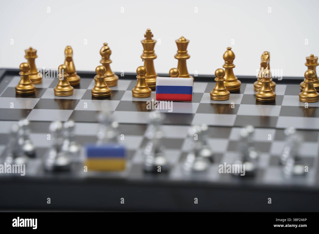 A chessboard with pieces and flags of Russia and Ukraine. Strategy ...