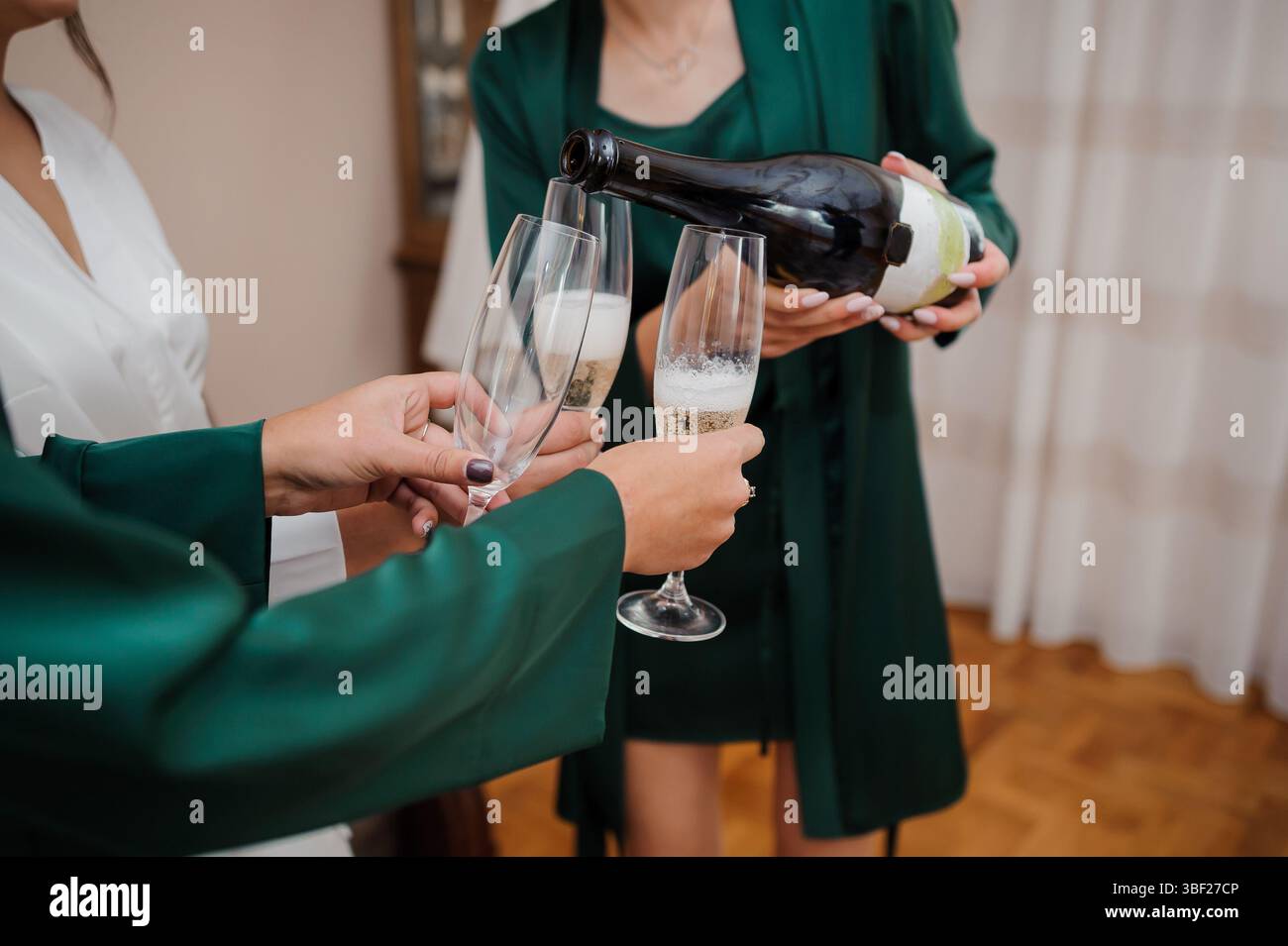 A cozy scene featuring two women, likely bridesmaids, getting ready for ...