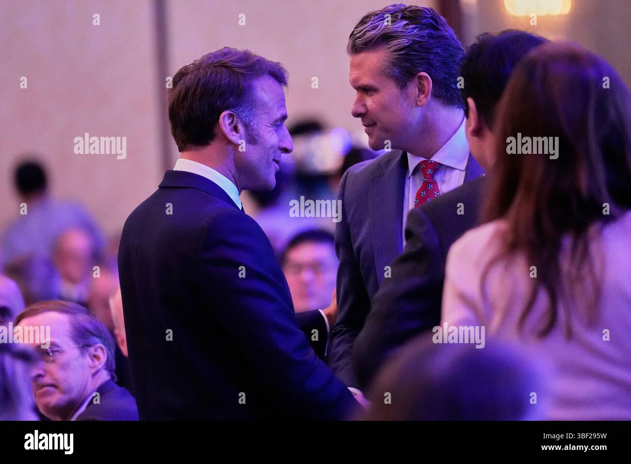 French President Emmanuel Macron, left, and U.S. Defense Secretary Pete ...
