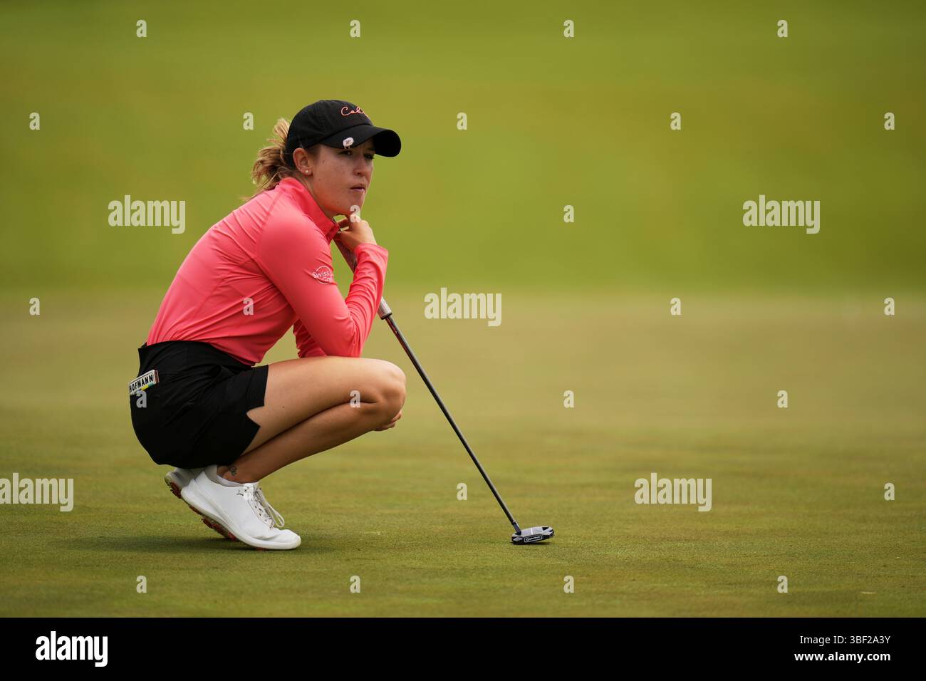 Chiara Tamburlini, of Switzerland, waits to putt on the 12th hole ...