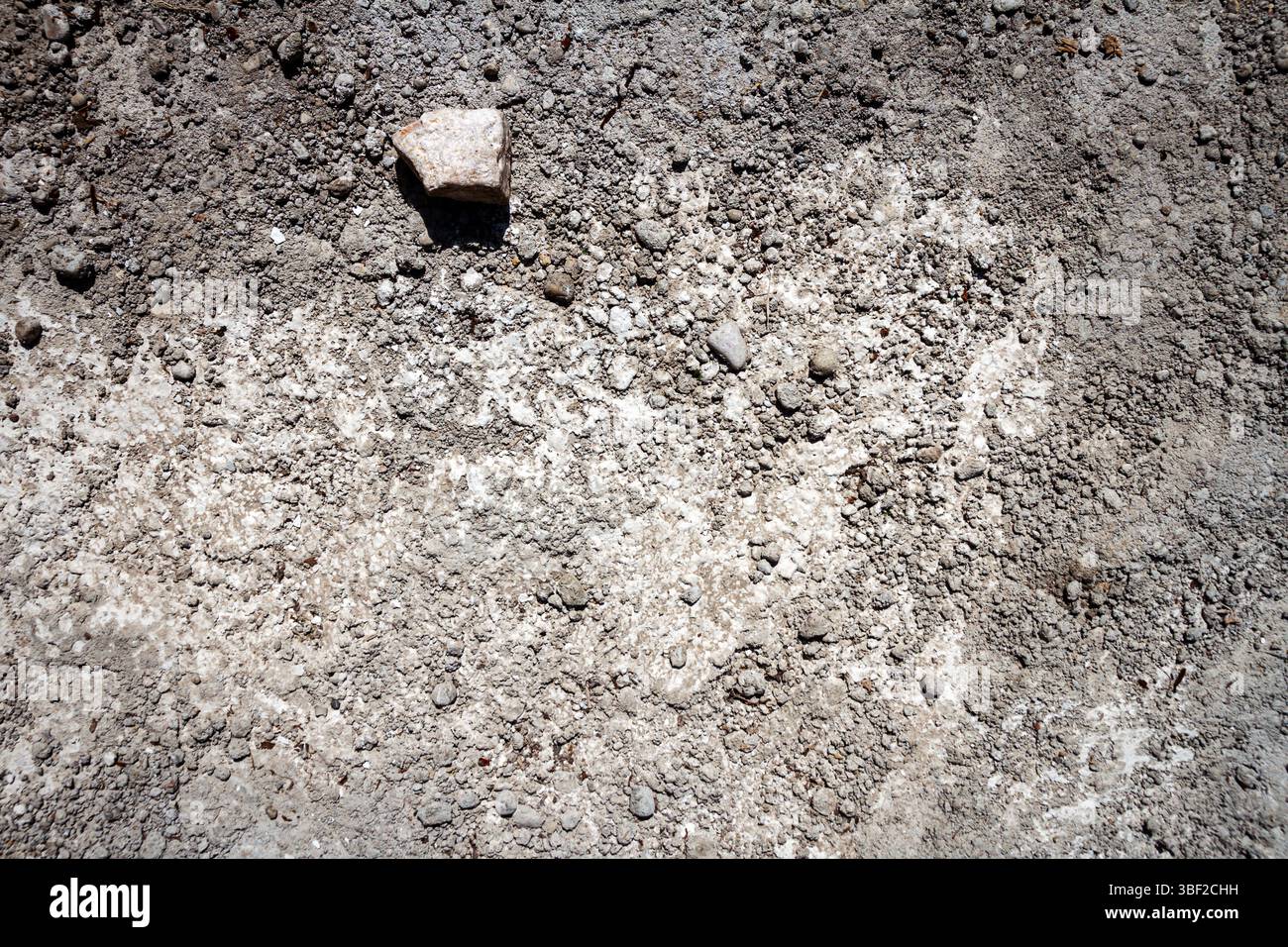 Concrete and cement stains on ground. Abstract messy construction ...
