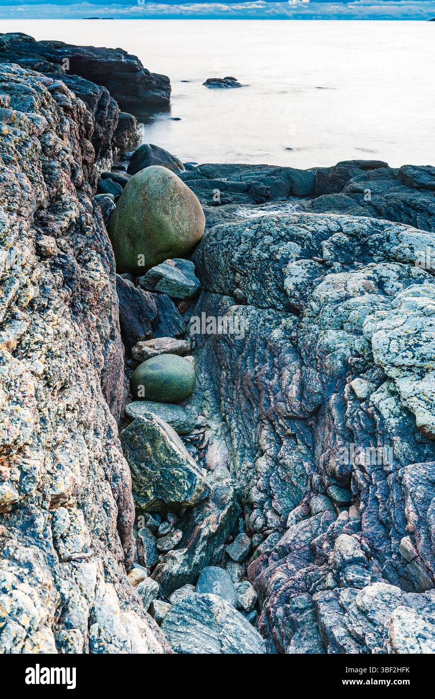 Boulders and jagged rocks create unique coastal features at ...