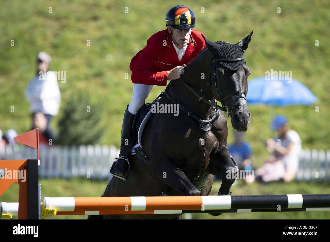 Marcus Ehning of Germany on Coolio 42 in action at the Land Rover ...