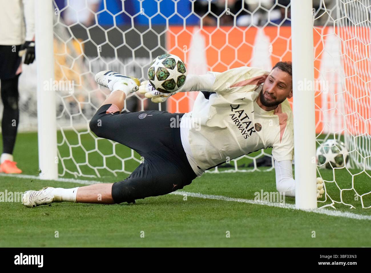PSG's goalkeeper Gianluigi Donnarumma makes a save during a training ...