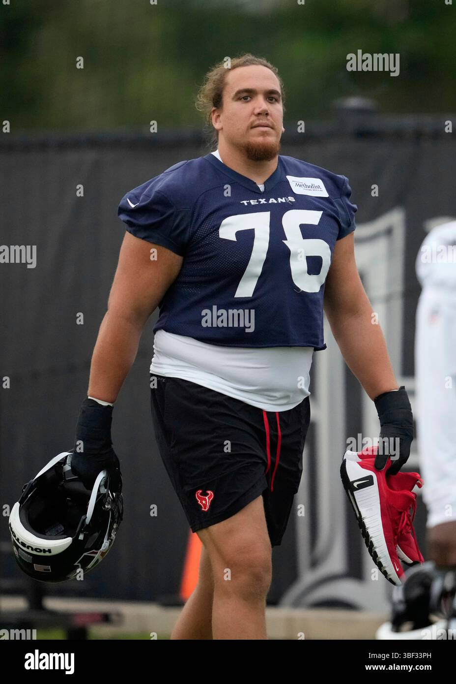 Houston Texans Austin Deculus walks to a practice field during NFL ...
