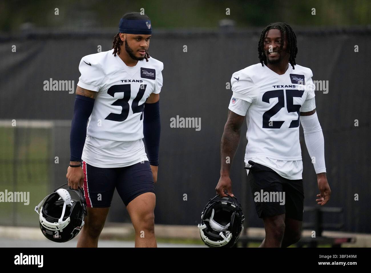 Houston Texans safety Jaylen Reed (34) and safety Russ Yeast (25) walk ...