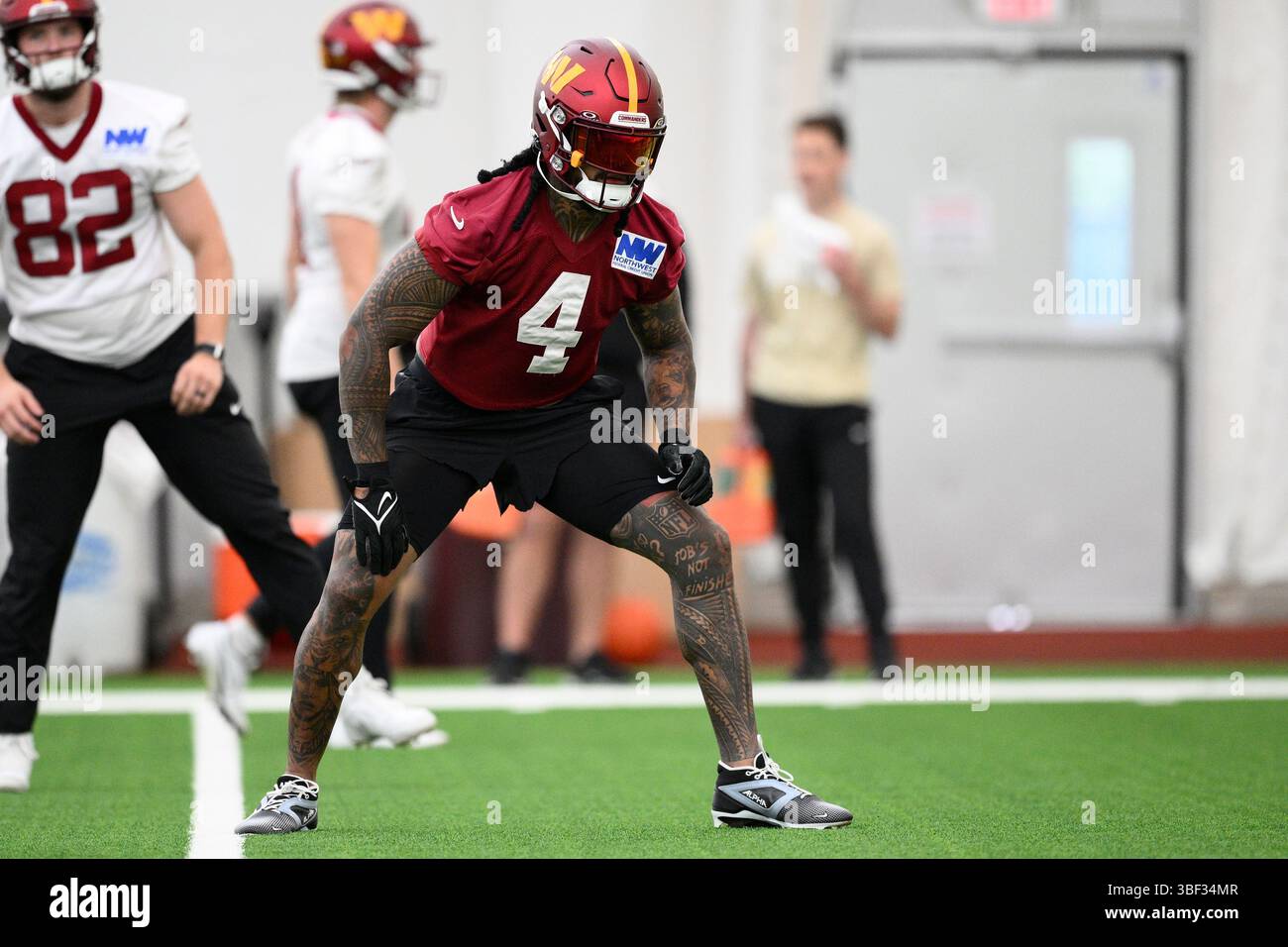 Washington Commanders linebacker Frankie Luvu (4) works out during NFL ...