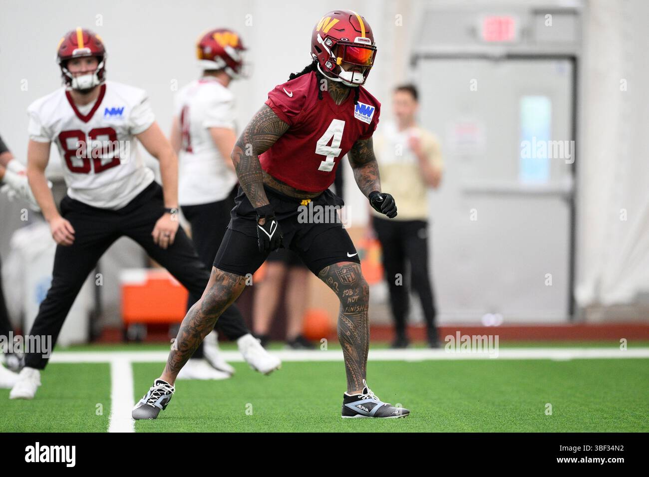 Washington Commanders linebacker Frankie Luvu (4) works out during NFL ...