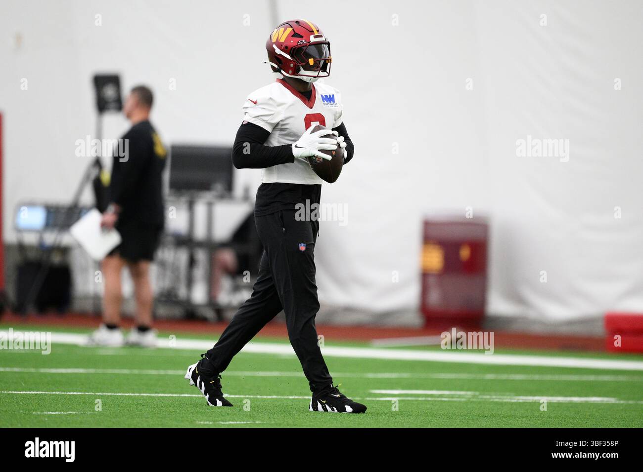 Washington Commanders running back Brian Robinson Jr. (8) works out ...