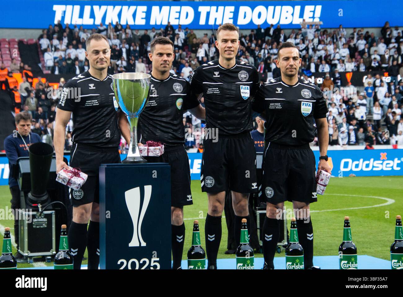 (L-R) Assistant referee Steffen Bramsen, Fourth official Lasse ...