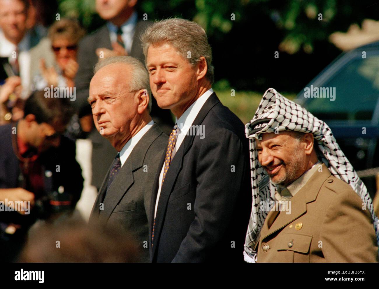 U.S. President Bill Clinton, flanked by Israeli Prime Minister Yitzhak ...